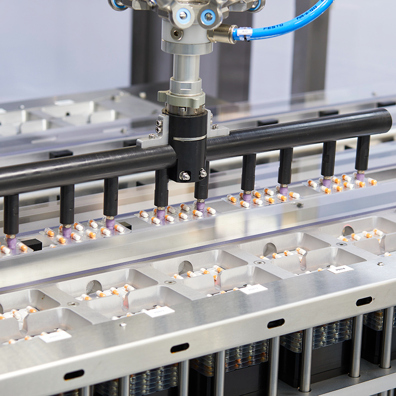 Blister Nesting and Stacking System